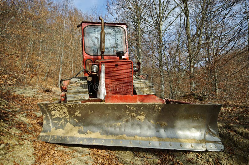 Red Bulldozer in the Forest Stock Photo - Image of construction, bucket ...