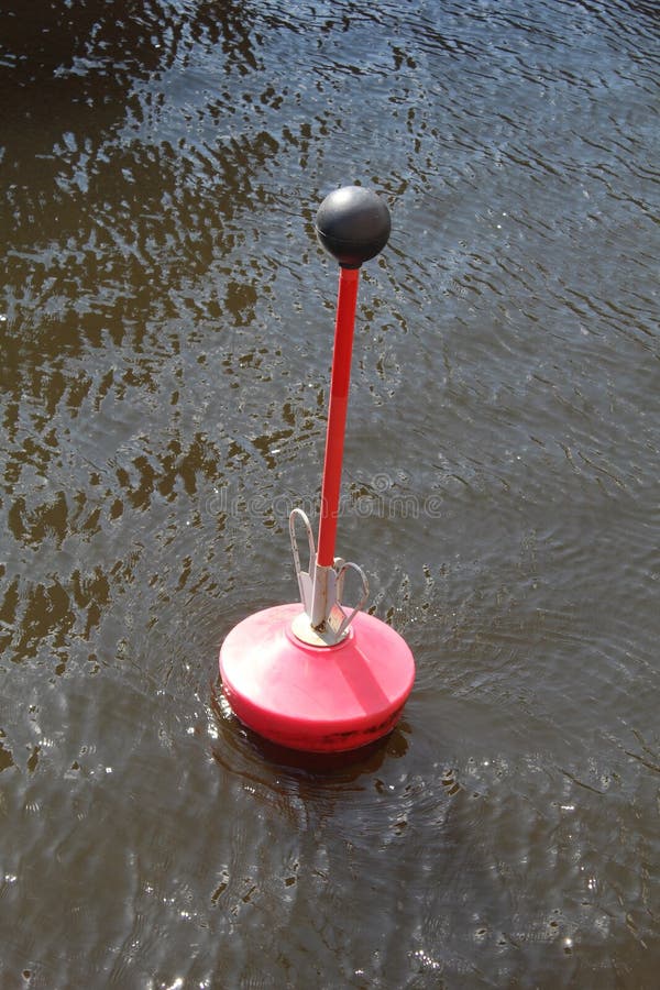 A Red Buoy Floats on the Surface of the River Stock Photo - Image of ...