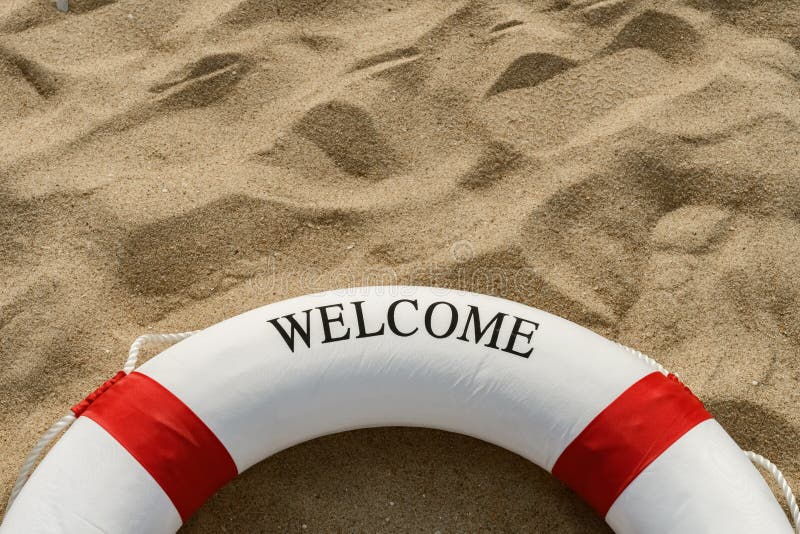 Red Buoy on Sand with Word of Welcome Aboard Stock Photo - Image of ...