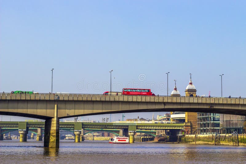 Red bus over a bridge editorial image. Image of holidays - 68181450