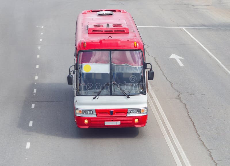 A Red Bus Runs Along the Road Stock Image - Image of glass, transport ...