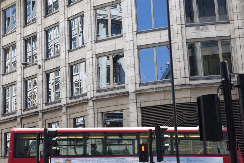 Red Bus and Windows from Offices in UK Stock Photo - Image of european ...