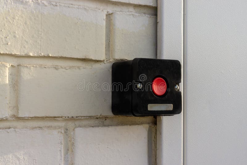 Red Button in Black Box on White Brick Wall Stock Photo - Image of ...