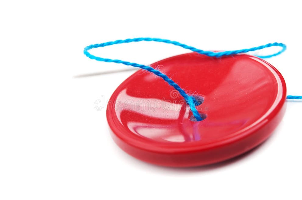 Red button and blue thread stock image. Image of design - 26215897