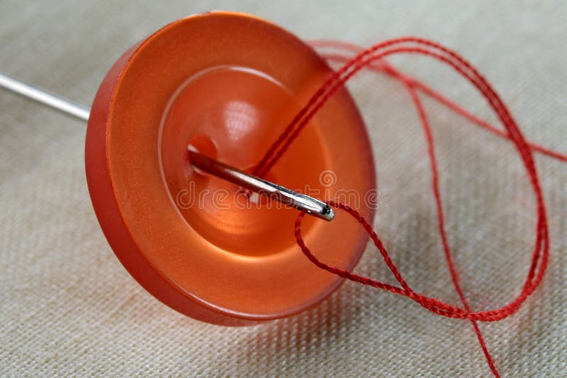 Red button with a needle stock image. Image of handmade - 236208829
