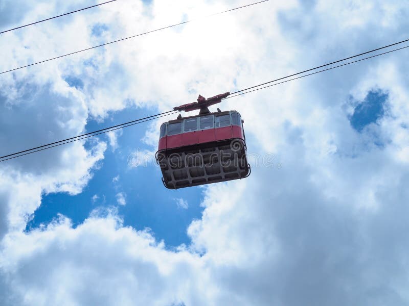 Red Cable Car Against the Cloudy Blue Sky Red Cable Car on the Mountain ...
