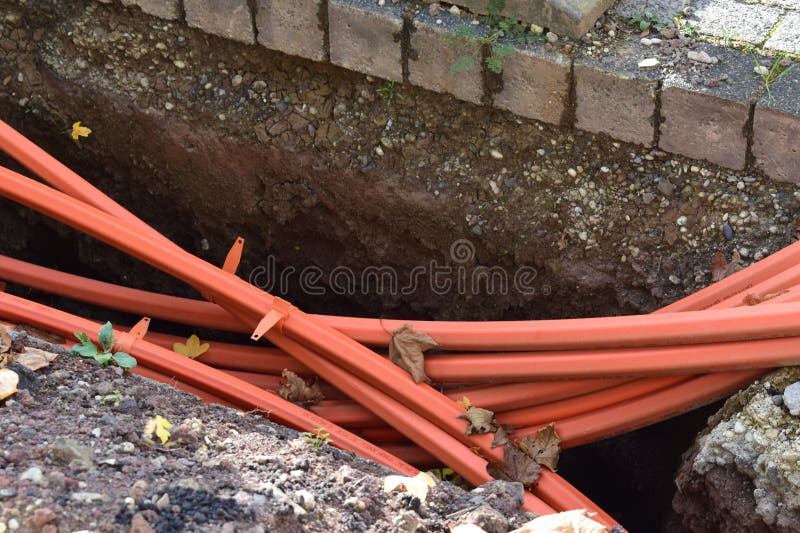 Red Cable in the Ground, Road Works Site Stock Image - Image of brick ...