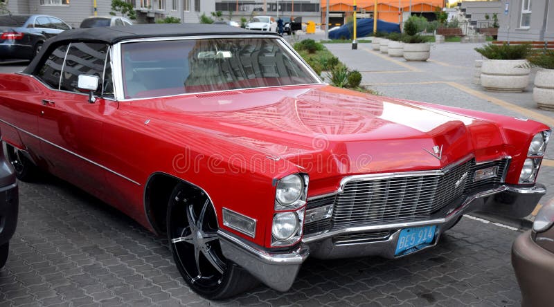 Red Cadillac in the yard editorial photography. Image of stylishly ...