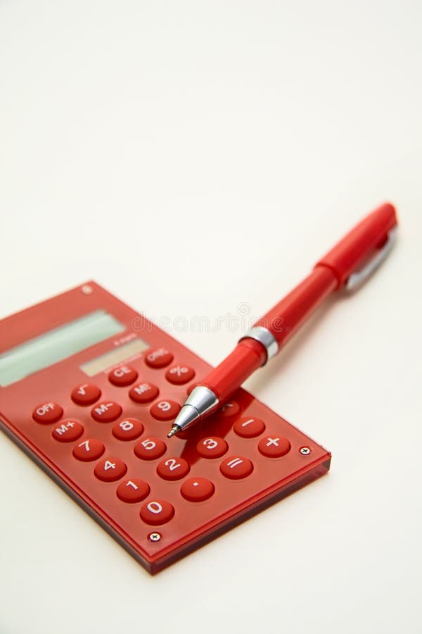 Red calculator and red pen stock photo. Image of numerical - 11260470