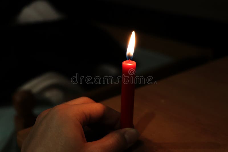 The Red Candle with Beautiful Flame in Hand Stock Image - Image of desk ...