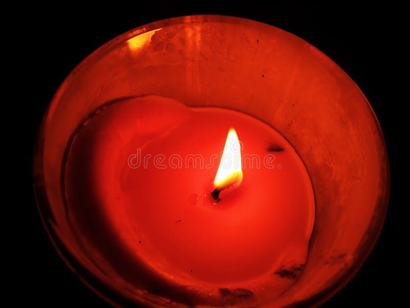 Red candle lit stock image. Image of faith, memory, glass - 183446369