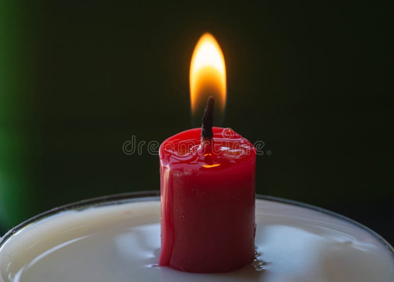 Red Candle Lit on Top of a Stone Stock Photo - Image of ritual ...
