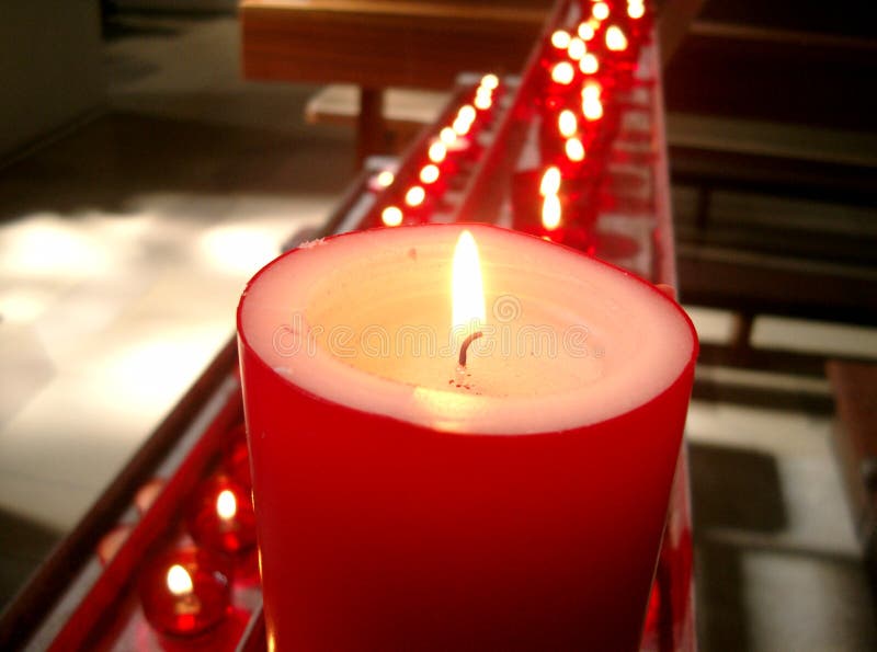 Red candles in a church stock image. Image of church, white - 1657