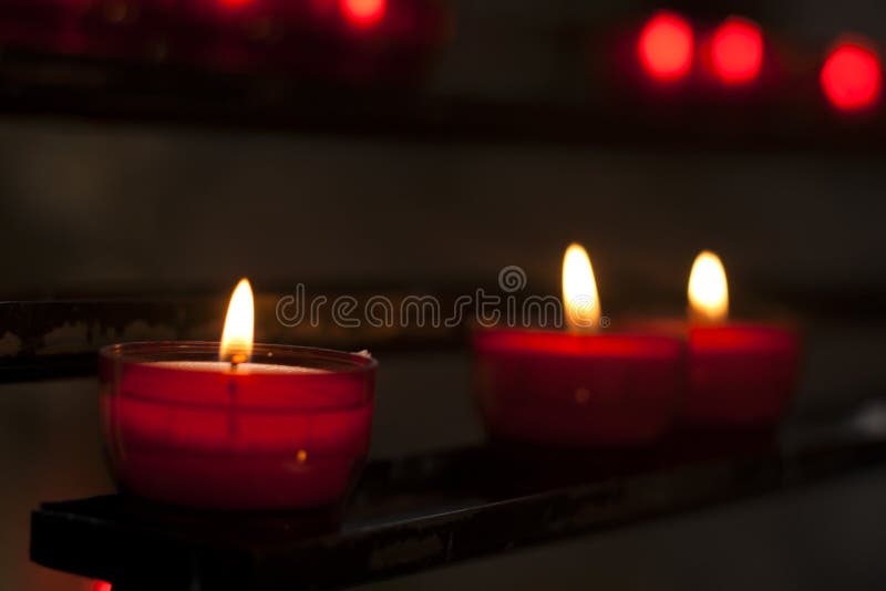 Red candles in a church stock photo. Image of memorial - 57506424