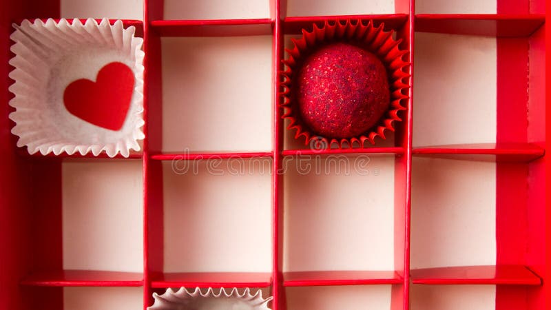 Red Candy Box with One Chocolate Raspberry Truffle and One Empty ...