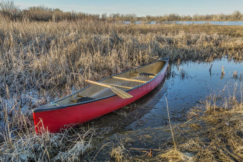 Red canoe in a wetland stock photo. Image of sport, canoe - 38785804