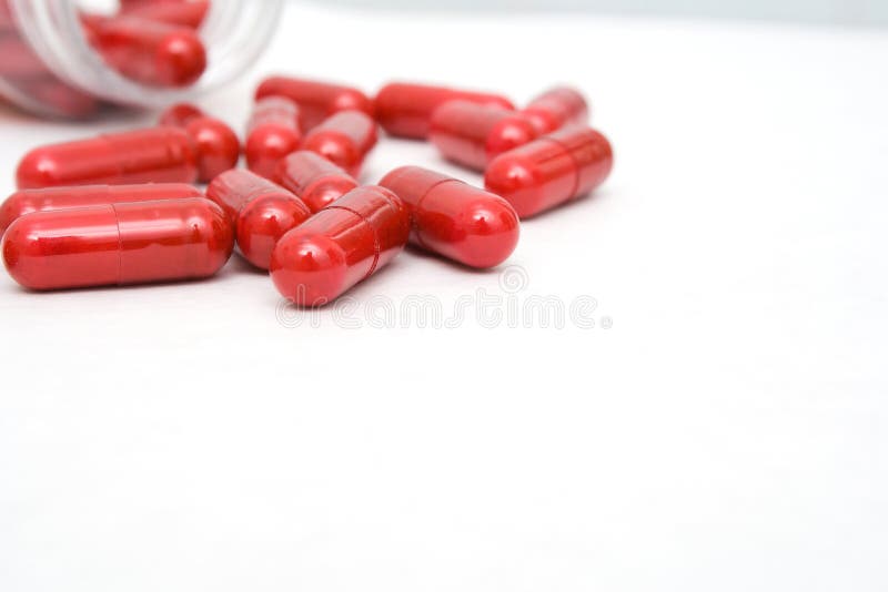 Red Capsules 1 stock photo. Image of macro, pills, blue - 508574