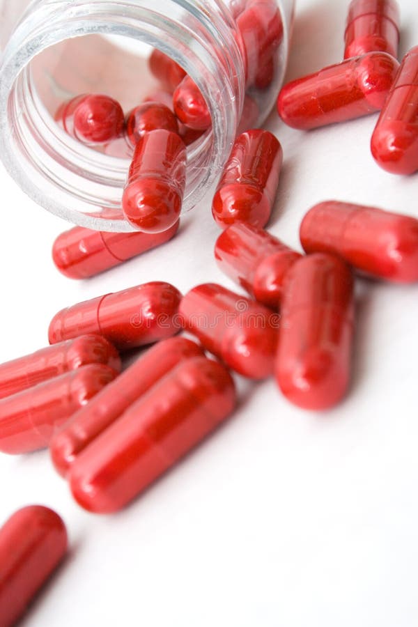 Red Capsules 1 stock photo. Image of macro, pills, blue - 508574