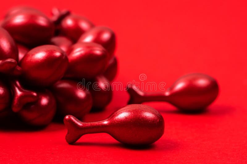 Red Capsules with Cosmetic Oil for the Face. Background for the Text ...