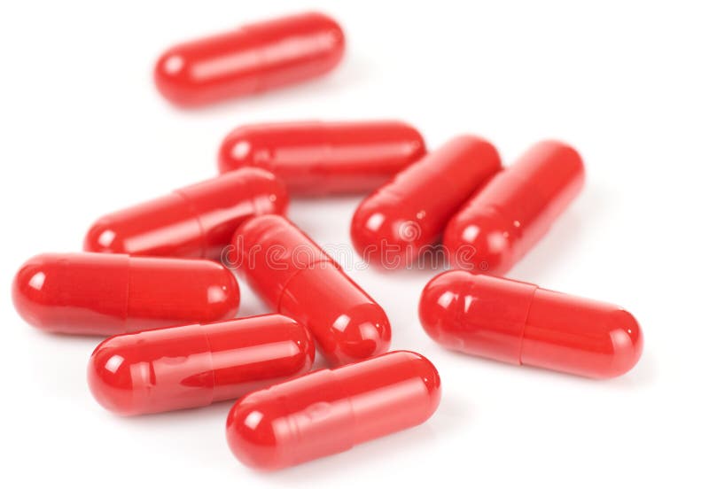 Red capsules shot on white stock photo. Image of anesthetic - 12029562