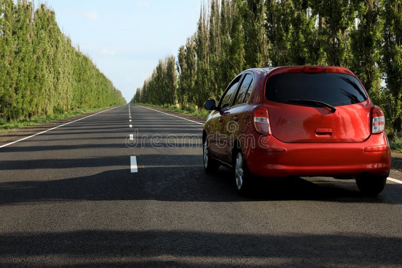 Red Car on Asphalt Road in Countryside Stock Image - Image of asphalt ...