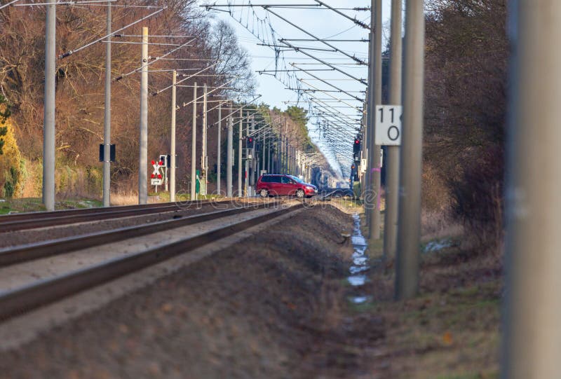 Red Car Drives Over a Railroad Stock Photo - Image of rail, crossing ...