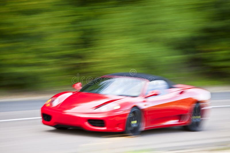 Red Car Driving Fast on Country Road Stock Image - Image of country ...