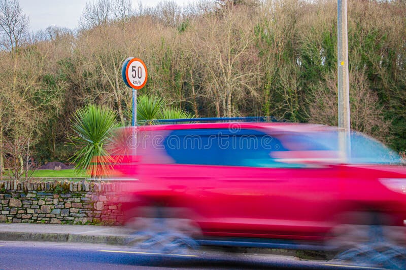 A Red Car is Driving Fast on a Road with a Speed Limit of 50 Km, the ...