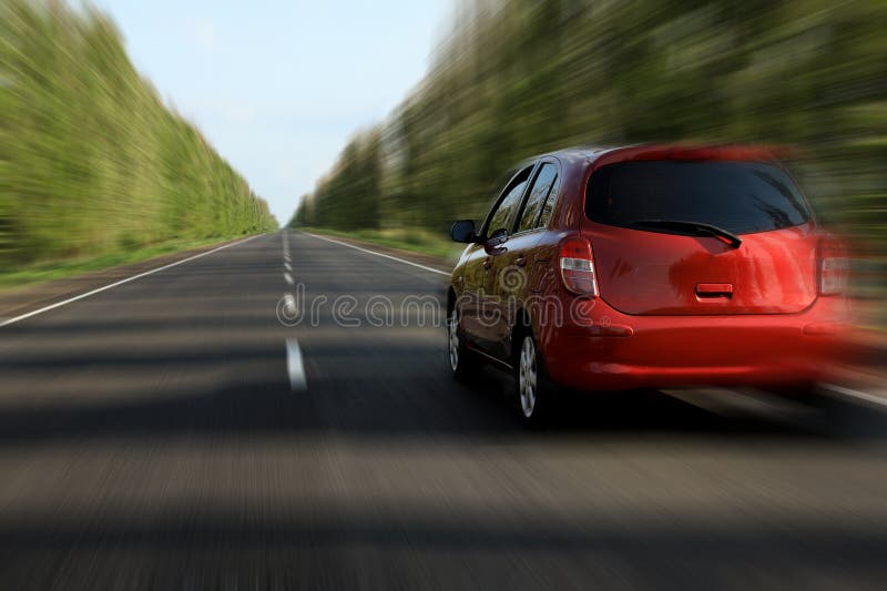Red Car Driving at High Speed on Asphalt Road Outdoors, Motion Blur ...