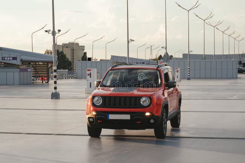Red Car in an Empty Parking Lot on a Sunny Day Stock Photo - Image of ...