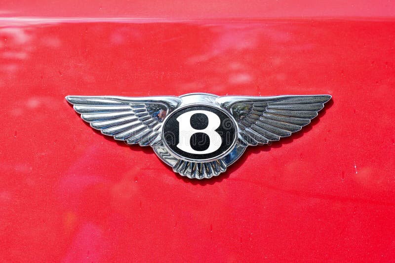 Red Car Featuring The Bentley Logo On Its Rear With Two Chrome Wings On The Sides Editorial