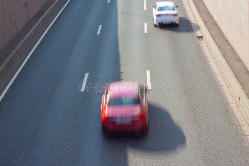 The Red Car Follows the White Car. Aerial View of the Freeway Stock ...