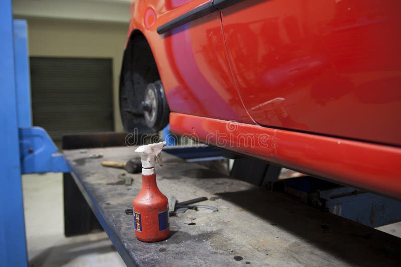 Red car at mechanics stock image. Image of equipment - 30869871