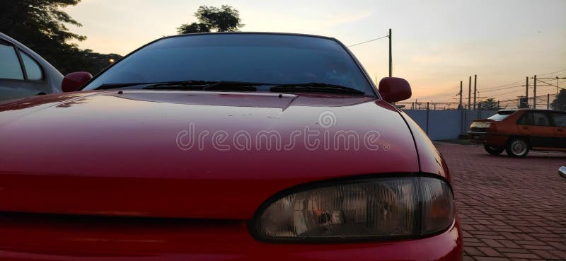 Red car in the morning editorial stock photo. Image of sunrise - 205762193