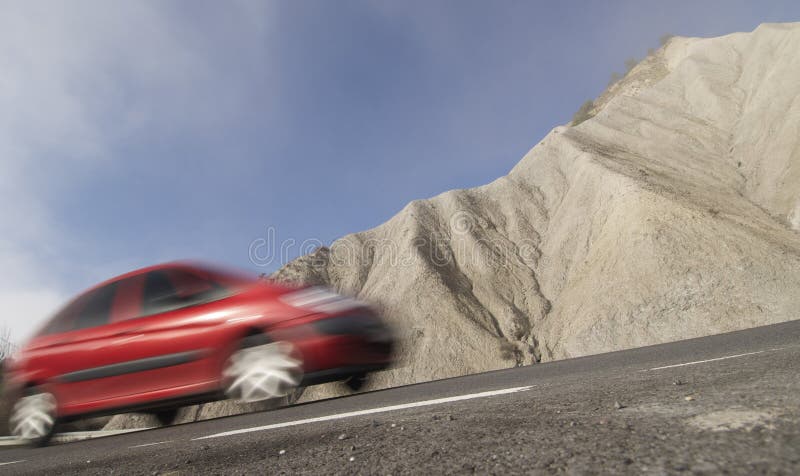 Red Car in Moving in a Arid Landscape Stock Image - Image of ...