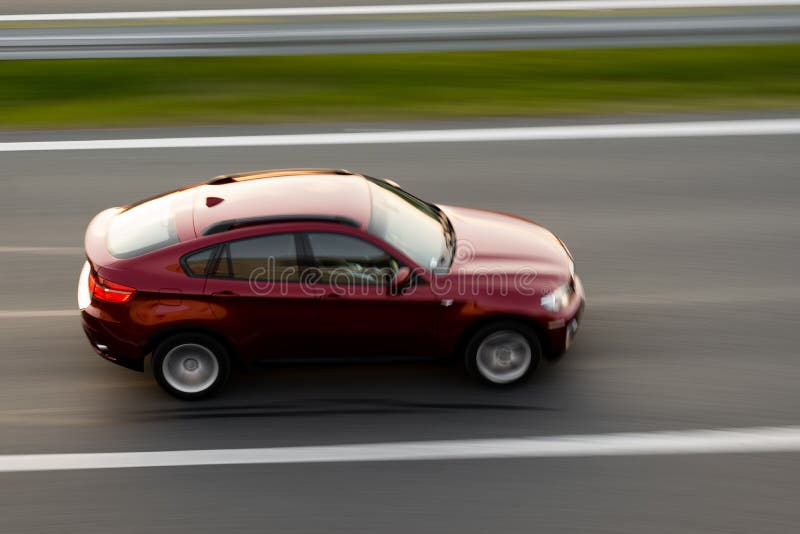 Red car moving fast stock image. Image of road, blur - 266129547