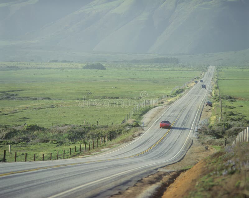 Red Car on Pacific Coast Highway, CA Stock Photo - Image of fences ...