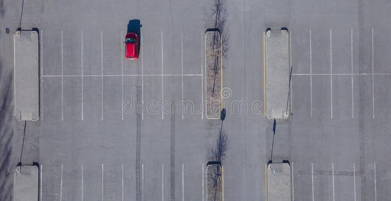 A Red Car is Parked in an Empty Parking Lot Stock Photo - Image of ...