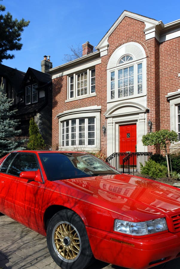 Red Car Parked In Front Of House Stock Photo - Image of brick, window ...