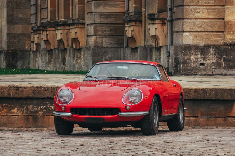 Red Car Parked on the Sidewalk in Front of an Old Building Editorial ...