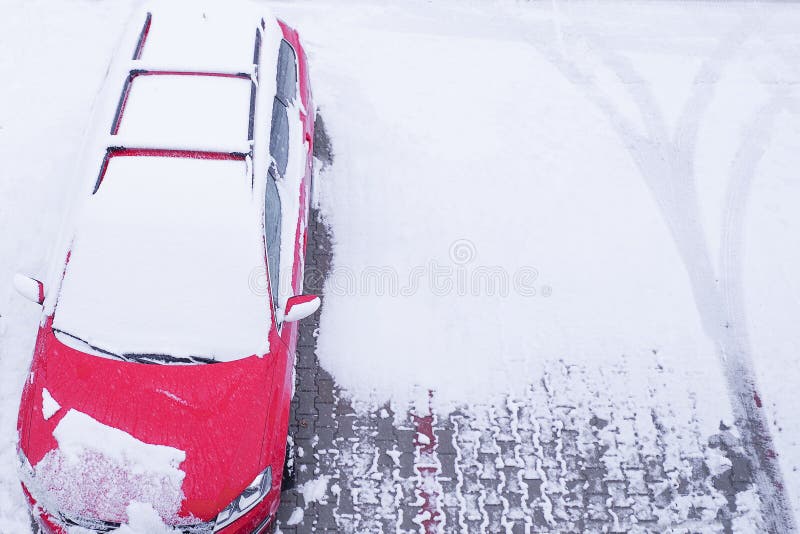 A Red Car is Parked in the Snow. Snowfall. Winter Season.Car Under Snow ...