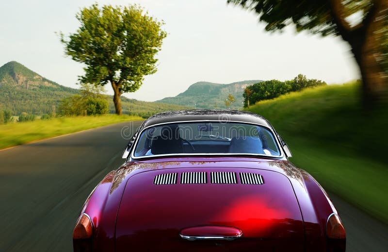 Red car on the road stock photo. Image of landscape - 111348652