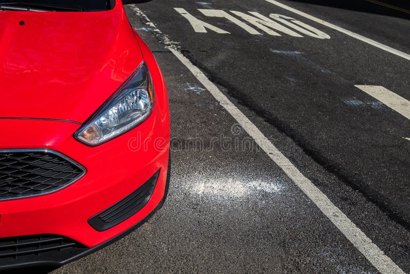 Red car on a road stock image. Image of headlight, markings - 95970465