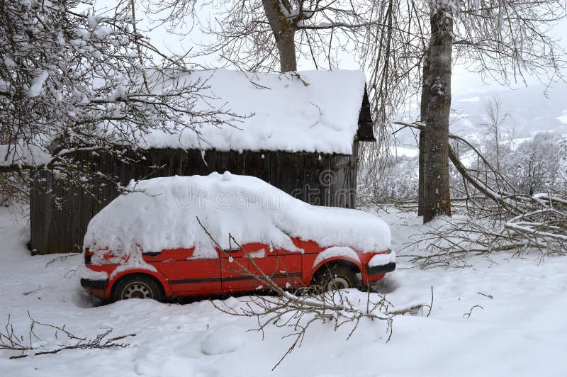 Red car in the snow stock photo. Image of plants, cold - 211698868