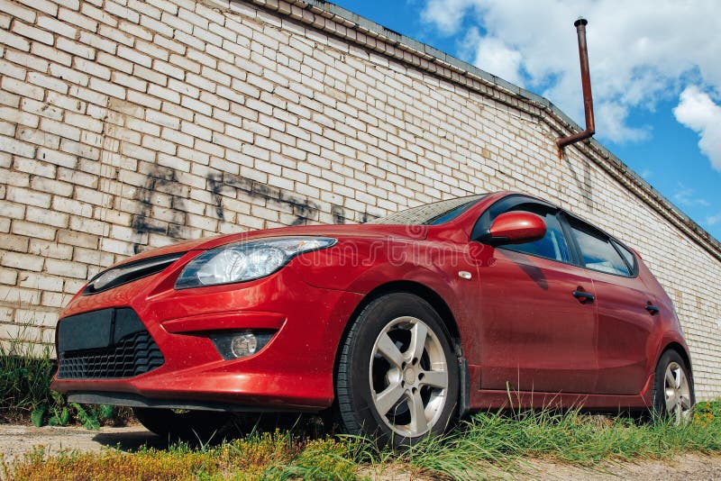 Red Car Standing Against Brick Wall Stock Photos - Free & Royalty-Free ...