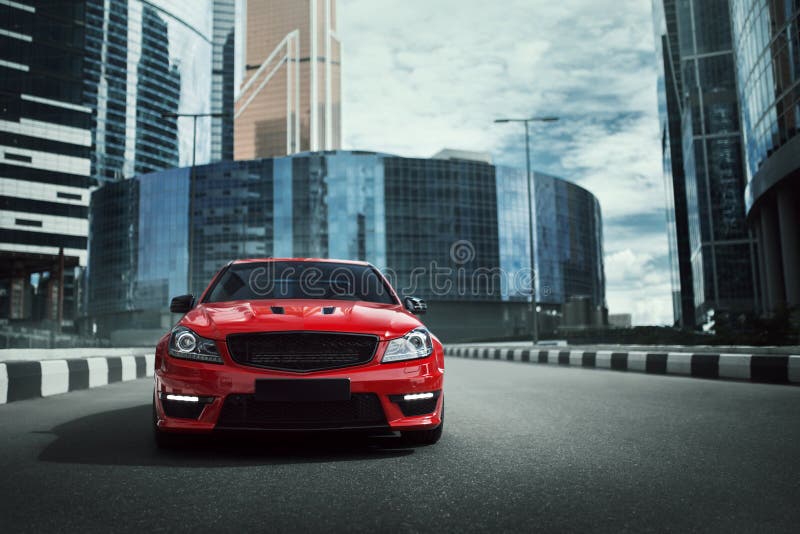 Red Car Stay on Asphalt Road in the City at Daytime Stock Image - Image ...