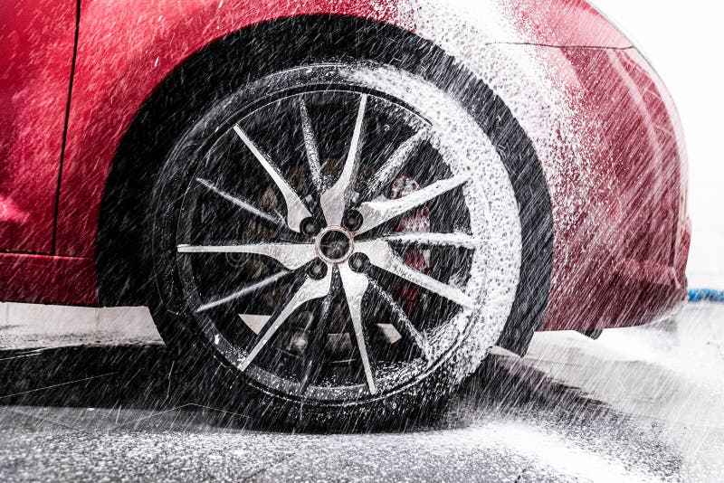 Red Car and Wheel Covered in Thick Active Foam for a Deep, Thorough ...