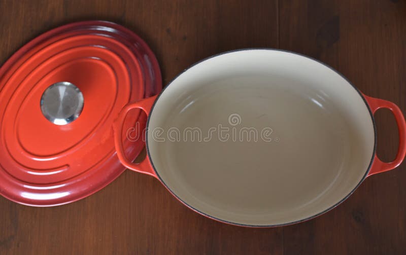 Red Cast Iron Oval Saucepan with Lid Stock Photo - Image of empty, food ...