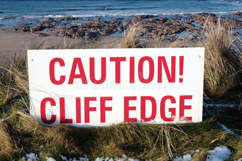 Red Caution Sign on Slippery Cliff Edge Stock Photo - Image of high ...