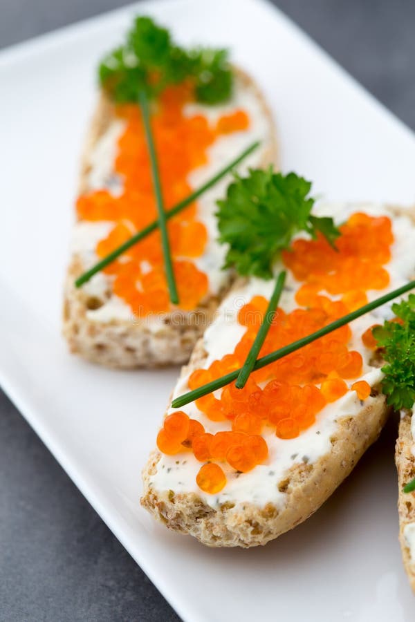 Red Caviar on Bread on White Plate. Stock Photo - Image of round, fish ...